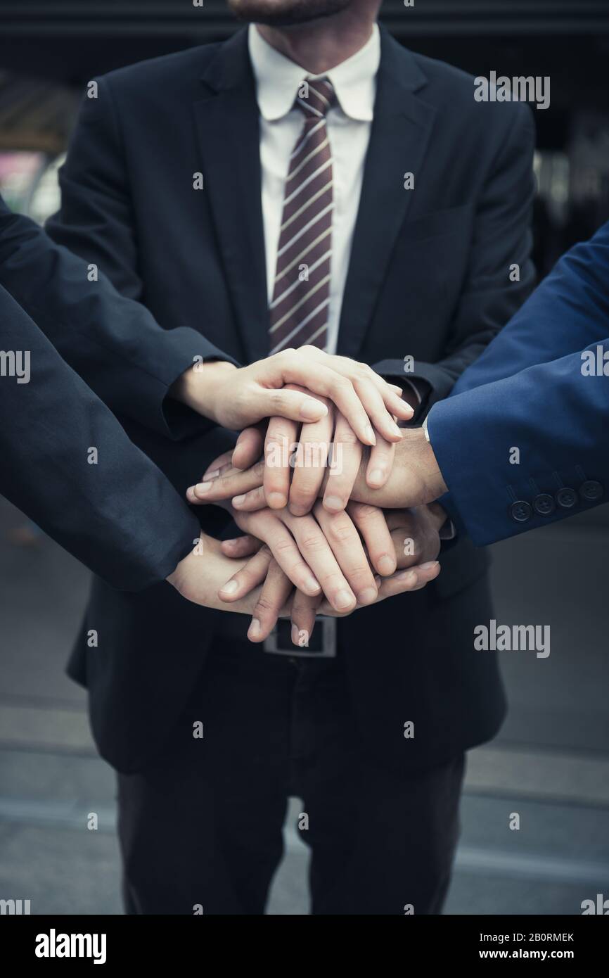 Group of Business Partners Team with hands together. People with ...