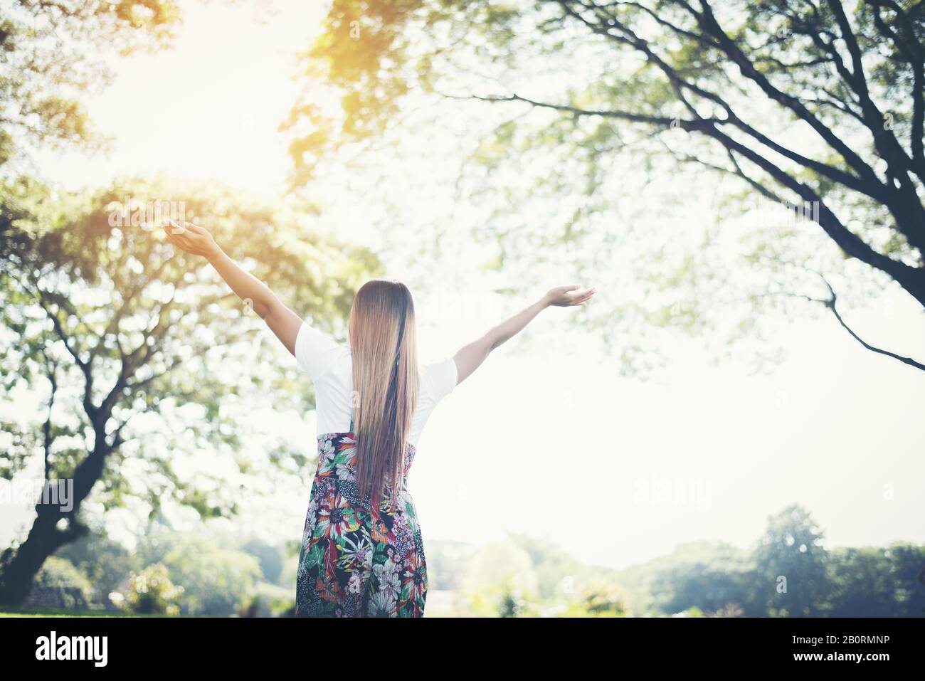 Happy woman in the park summer with open hands , Relax time and ...