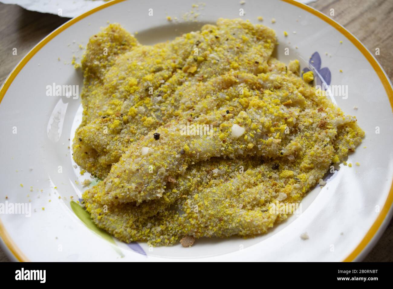 fresh plaice fillets just breaded with crumb and egg Stock Photo - Alamy