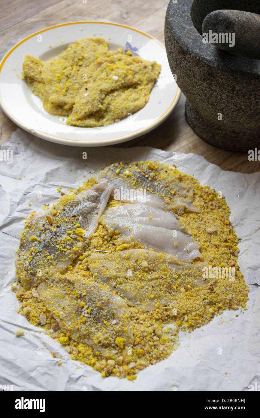 fresh plaice fillets just breaded with crumb and egg Stock Photo - Alamy