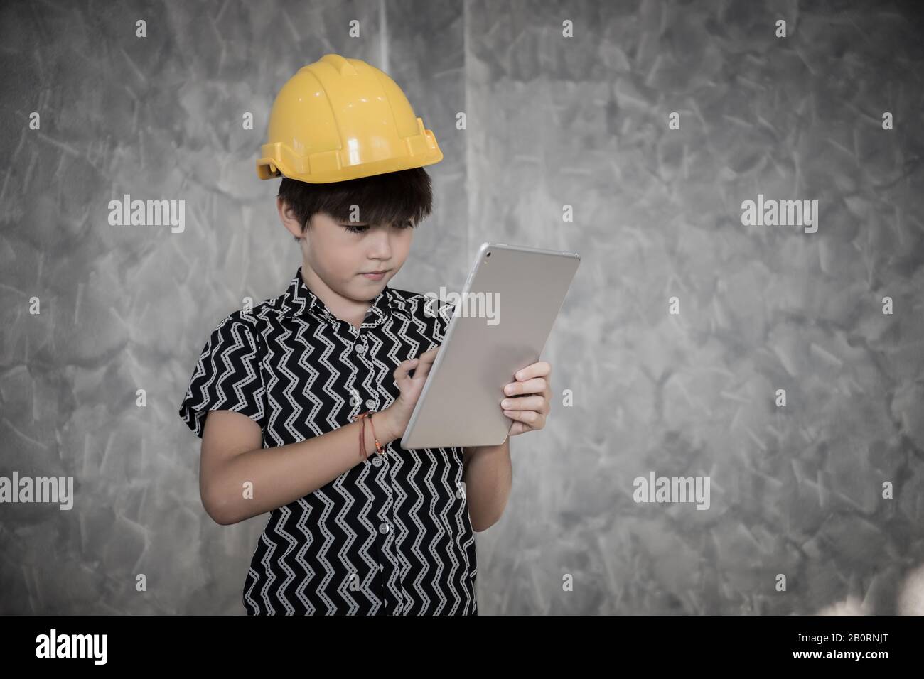 Little boy engineer standing in his home Stock Photo - Alamy