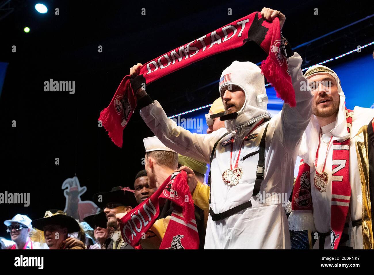 The players of FC Cologne, sing on the stage, with fan scarf: Marco ...