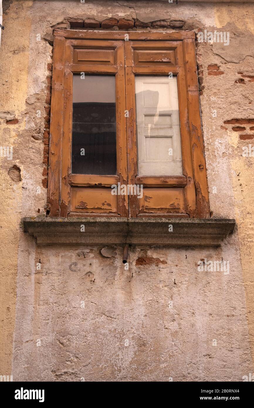 facade of an abandoned home with ruined and disused windows Stock Photo ...