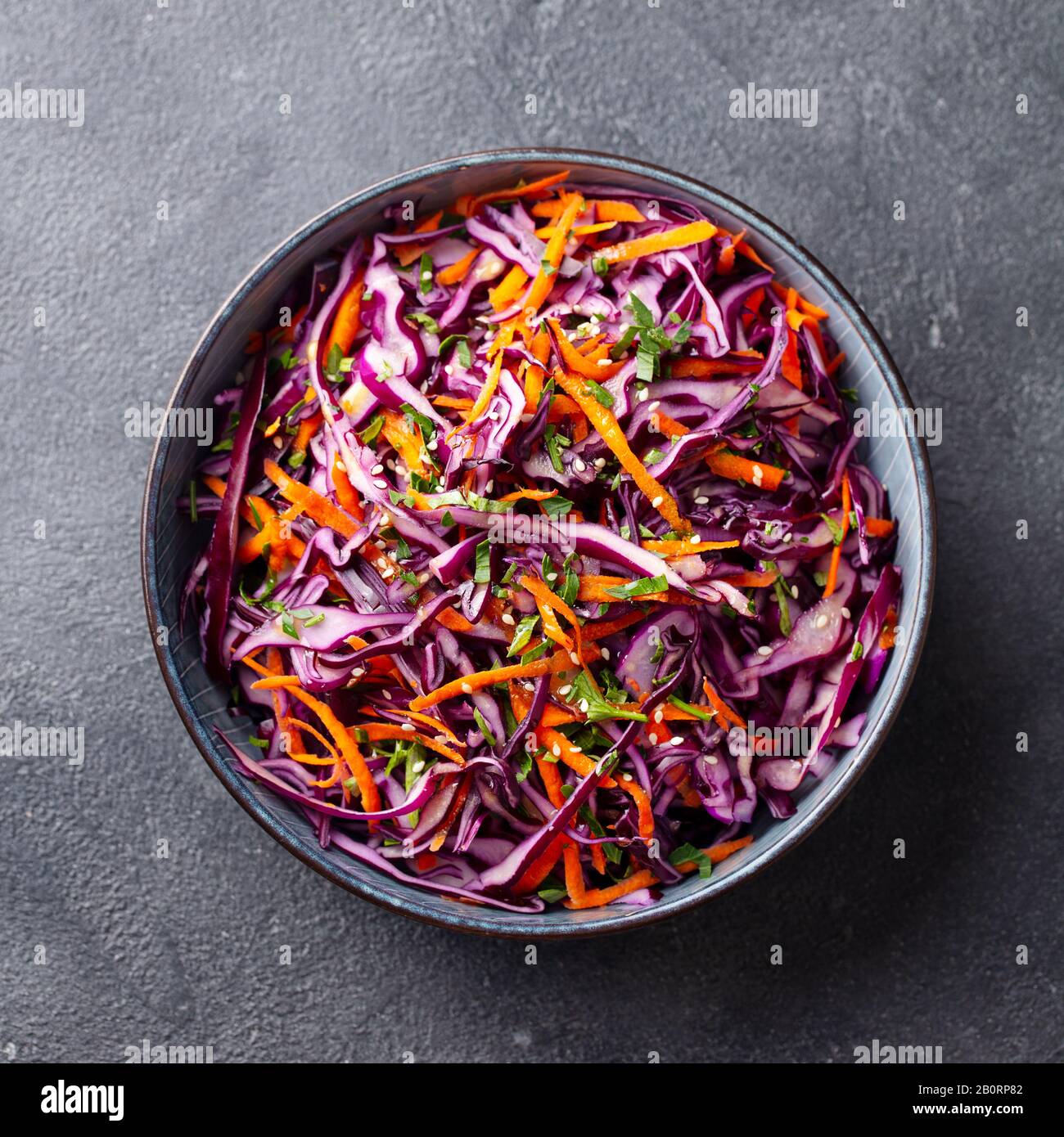 Red cabbage salad, Coleslaw in a bowl. Grey background. Close up. Top ...