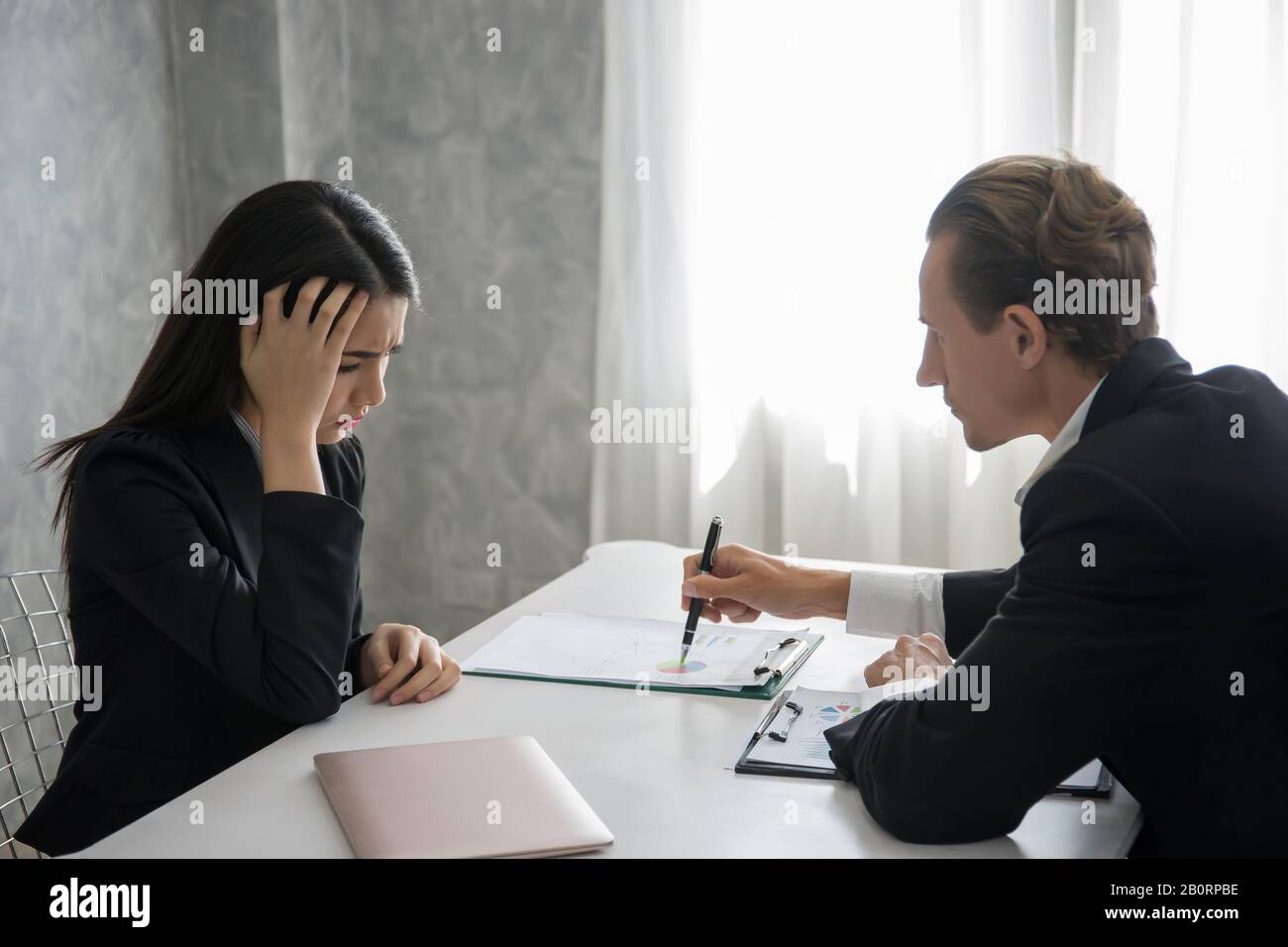 Leader businessman blaming female employee at office desk. Fail ...