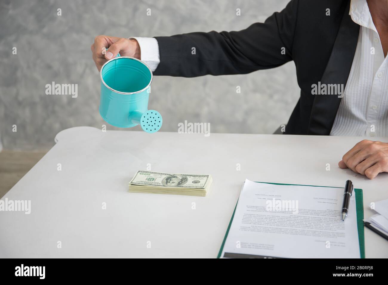 Water Pouring on dollar banknotes at workplace Stock Photo - Alamy