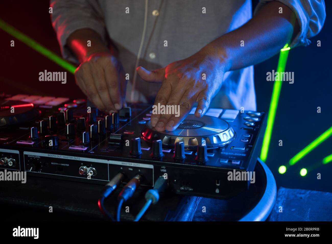 DJ playing turntable music on night club party Stock Photo - Alamy