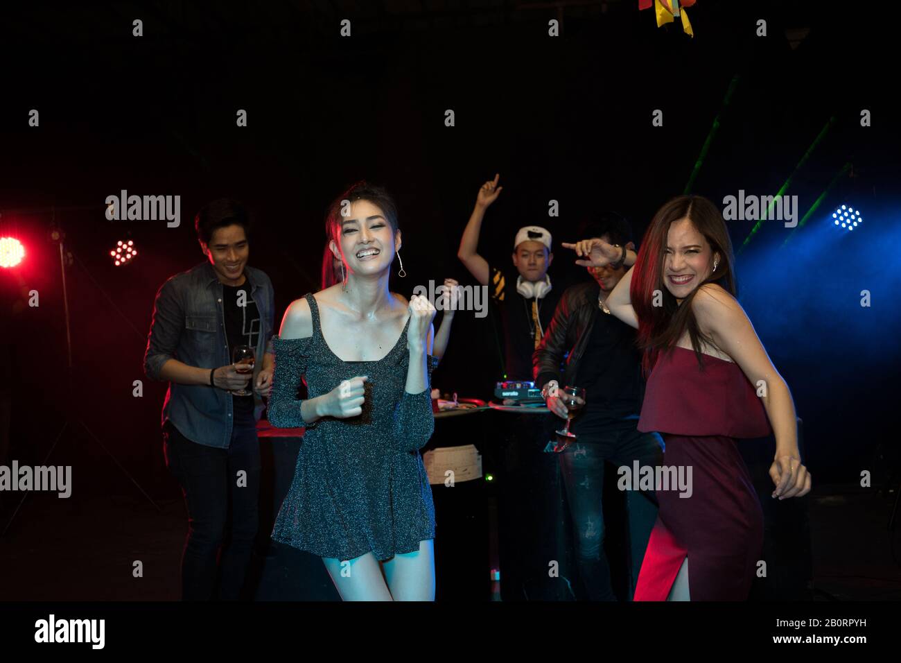 Party young people group dancing in night club Stock Photo - Alamy