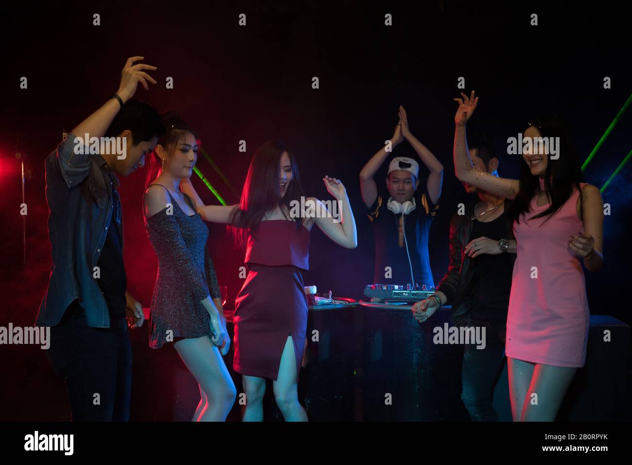 Party young people group dancing in night club Stock Photo - Alamy