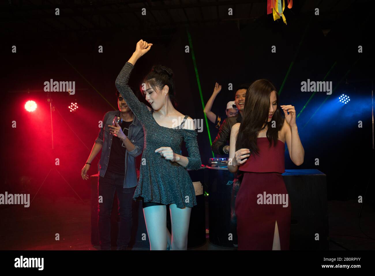 Party young people group dancing in night club Stock Photo - Alamy