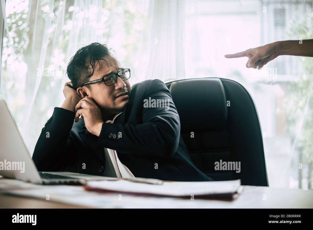 Worried business man at workplace in office after tired from hard work ...