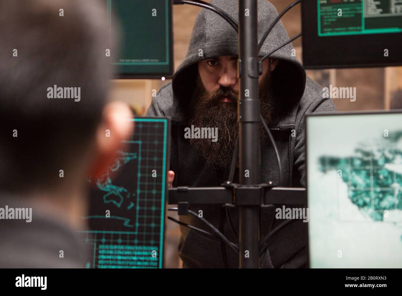 Shot of dangerous cyber criminals hacking credit cards from computer ...