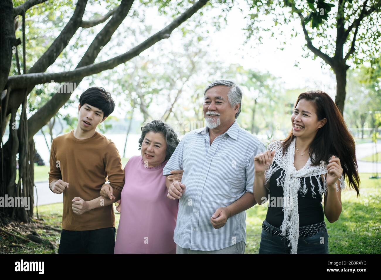 happy family walking outdoor in the park Stock Photo - Alamy