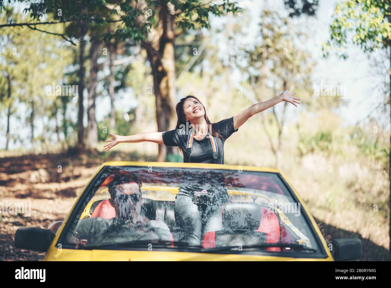 Happy Couple Driving in Convertible Stock Photo - Alamy
