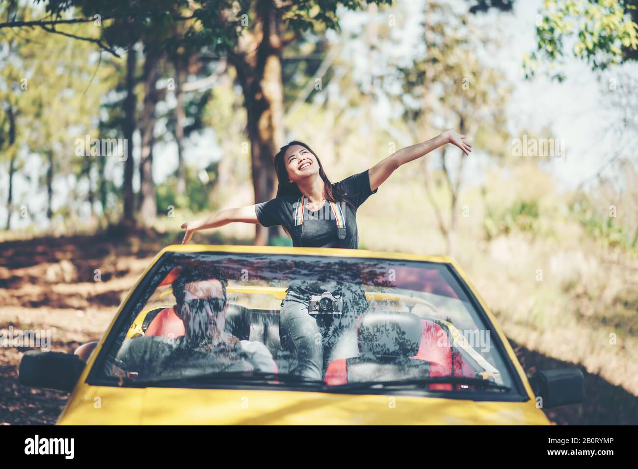 Happy Couple Driving in Convertible Stock Photo - Alamy