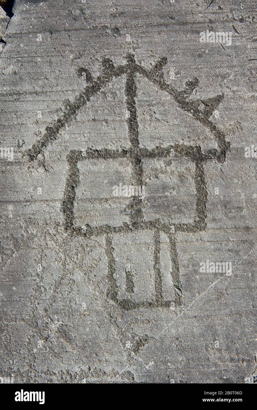 Petroglyph, rock carving, of a house on stilts. Carved by the ancient ...