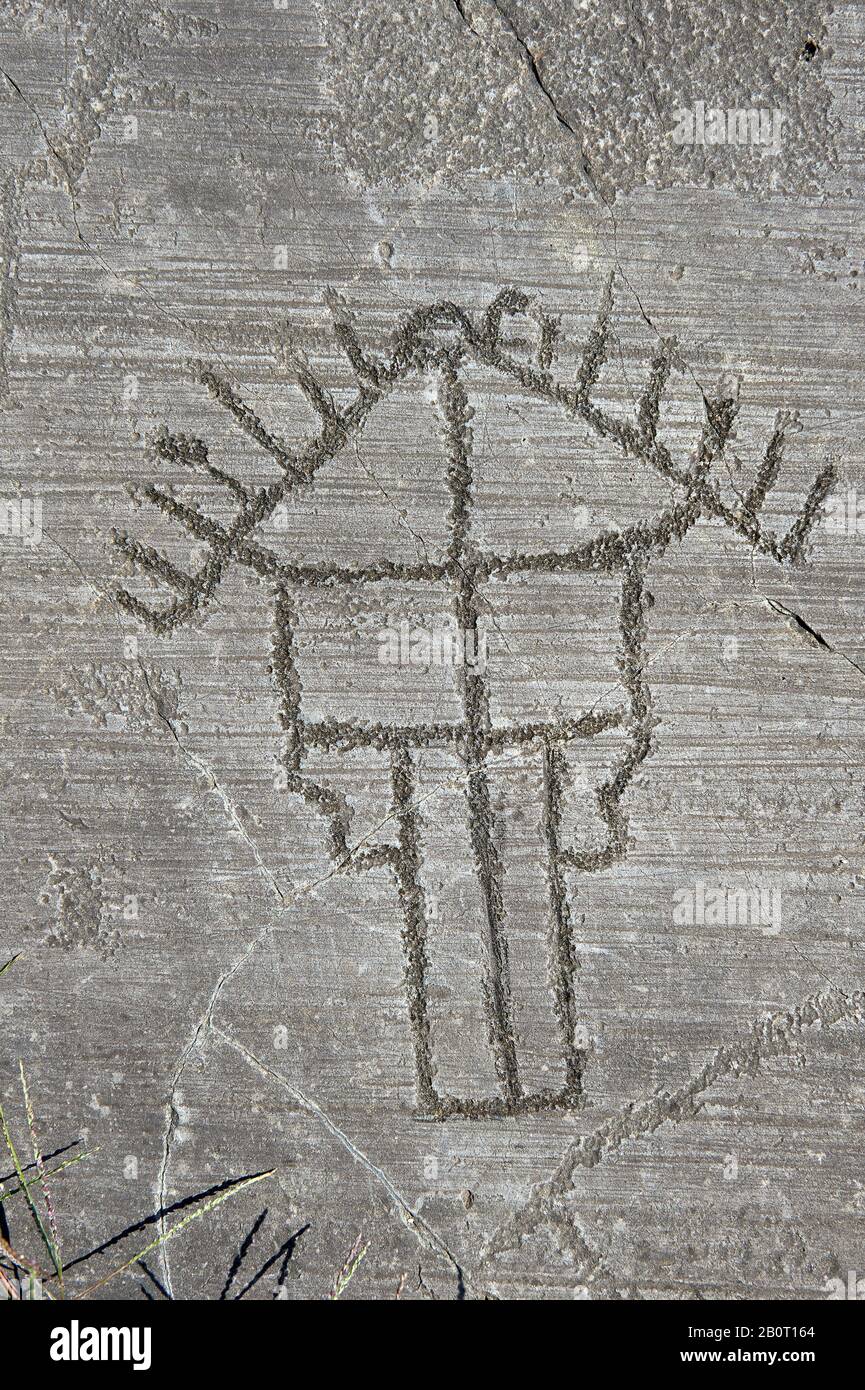 Petroglyph, rock carving, depicting a two storey house built on poles ...