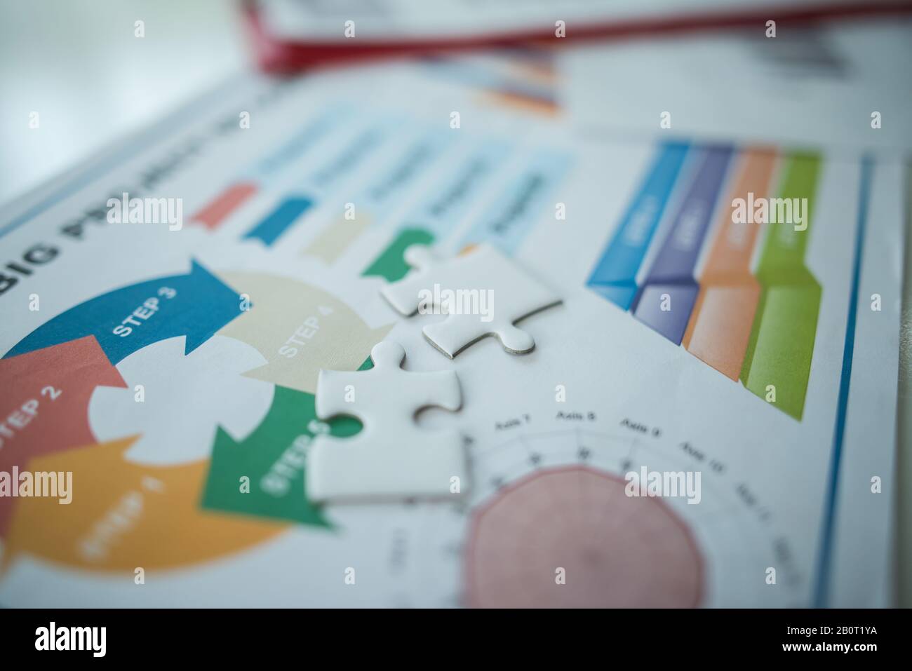 business documents over papers with numbers and charts. View from above ...