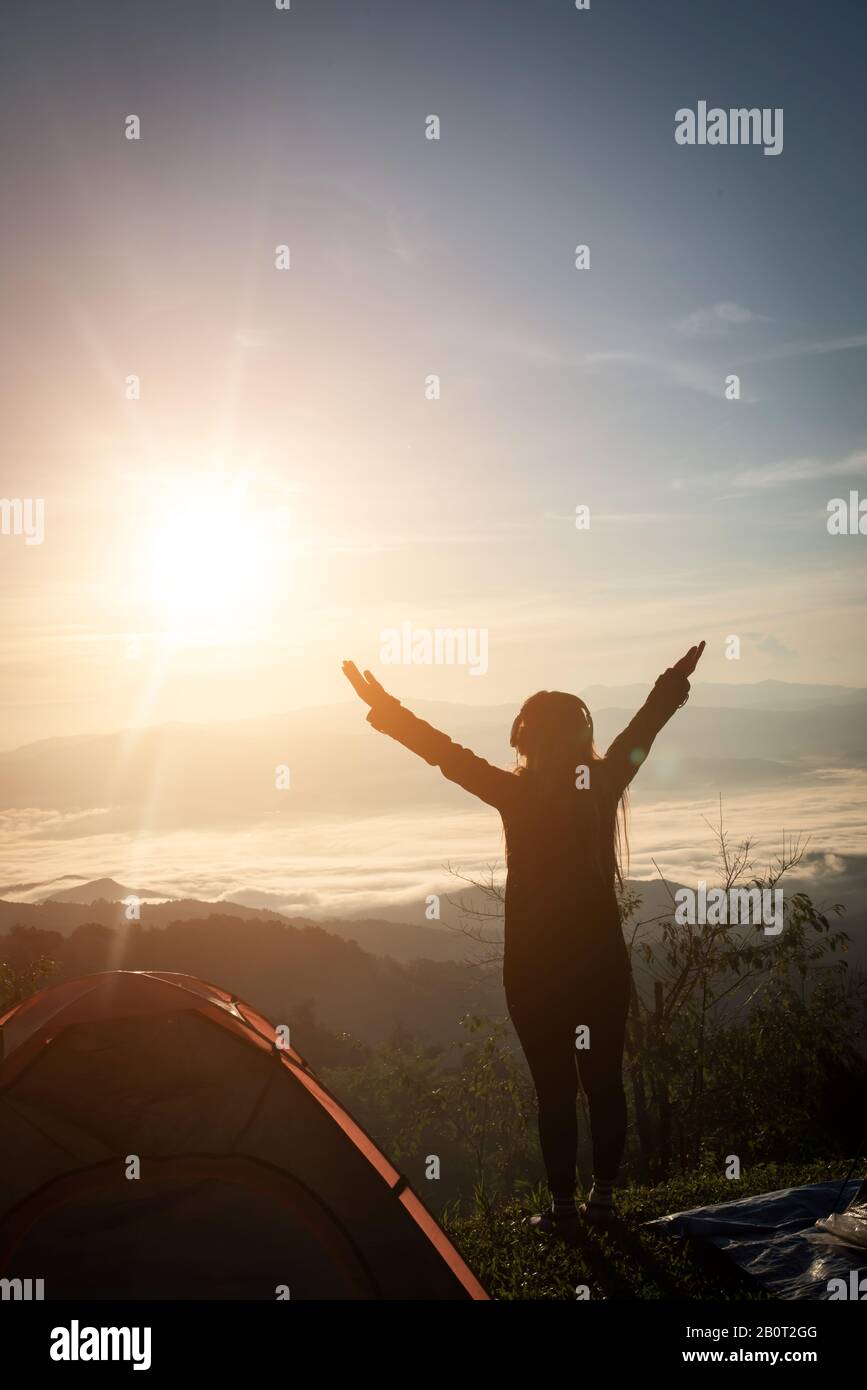 Happy Young Woman Hiker With Open Arms Raised at Sunset on Mountain ...