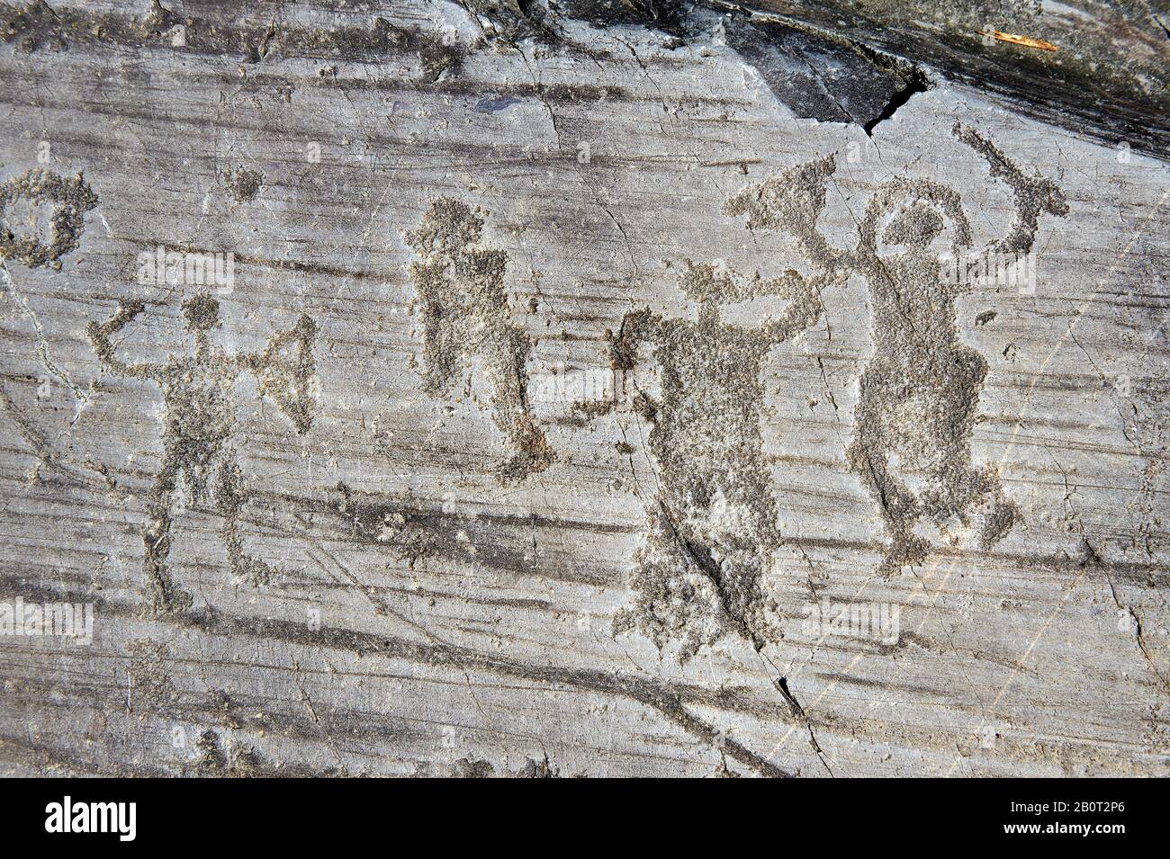 Petroglyph, rock carving, of a warriors with a shields and swords ...