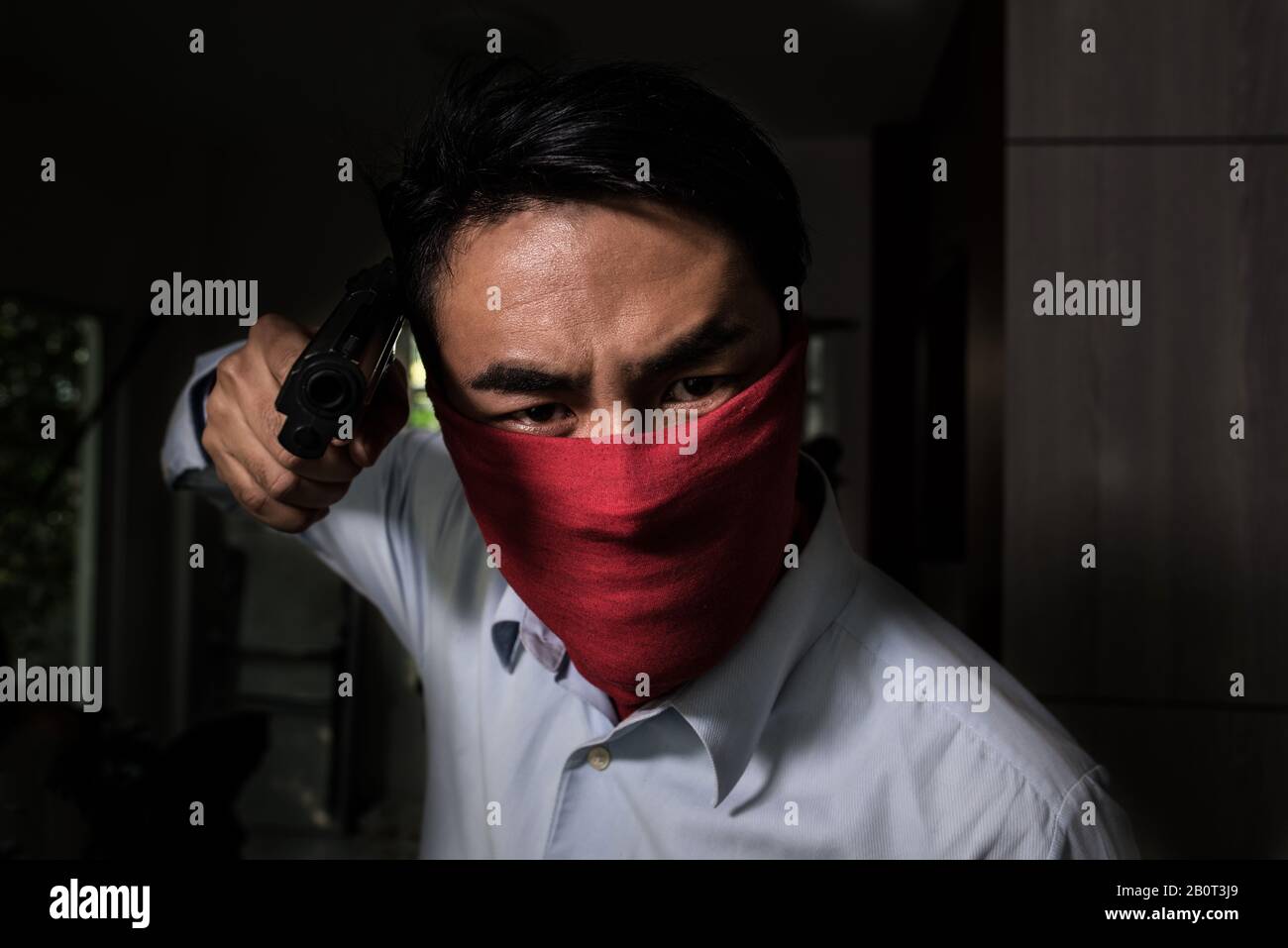 man with pistol handgun weapon Stock Photo - Alamy