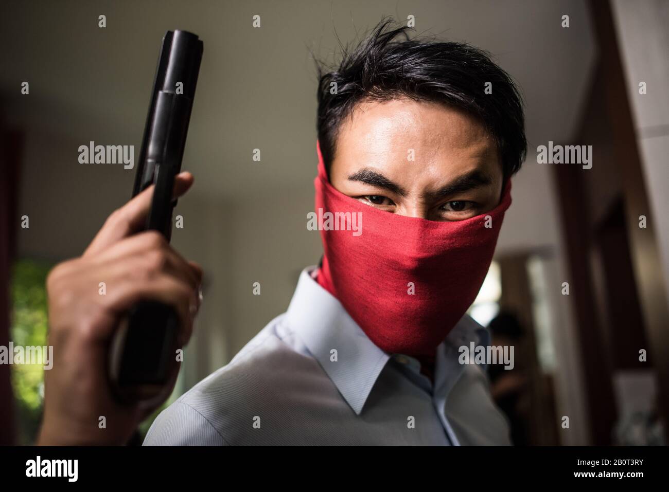 man with pistol handgun weapon Stock Photo - Alamy