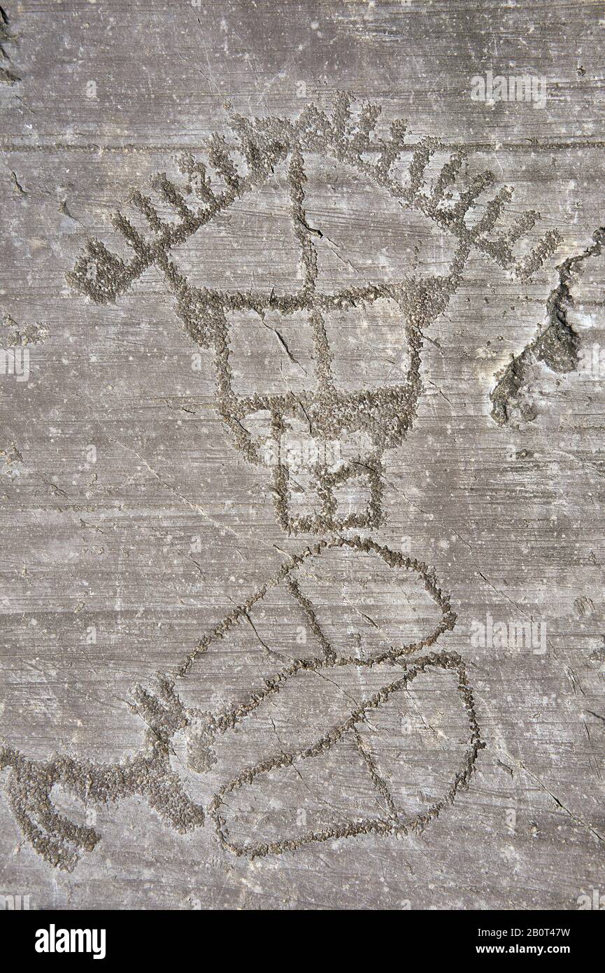 Prehistoric Petroglyph, rock carving, of a hut raied on wooden ploes ...