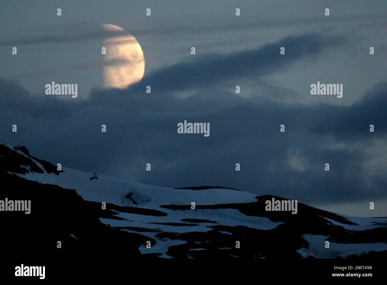 Moon in Icelandic sky, Iceland Stock Photo - Alamy
