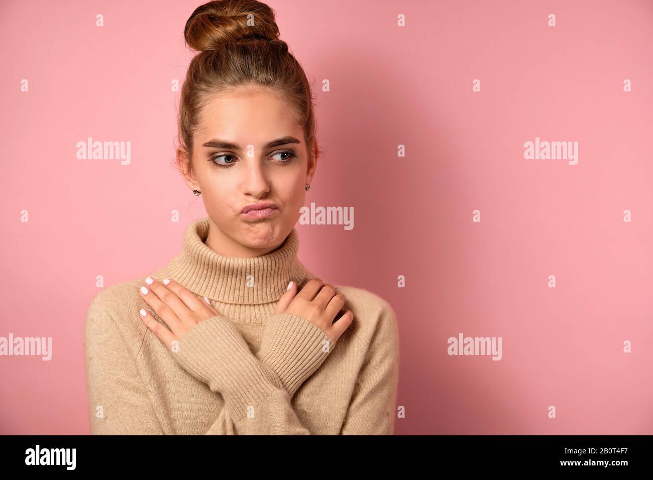 Woman with arms crossed over chest hi-res stock photography and images ...