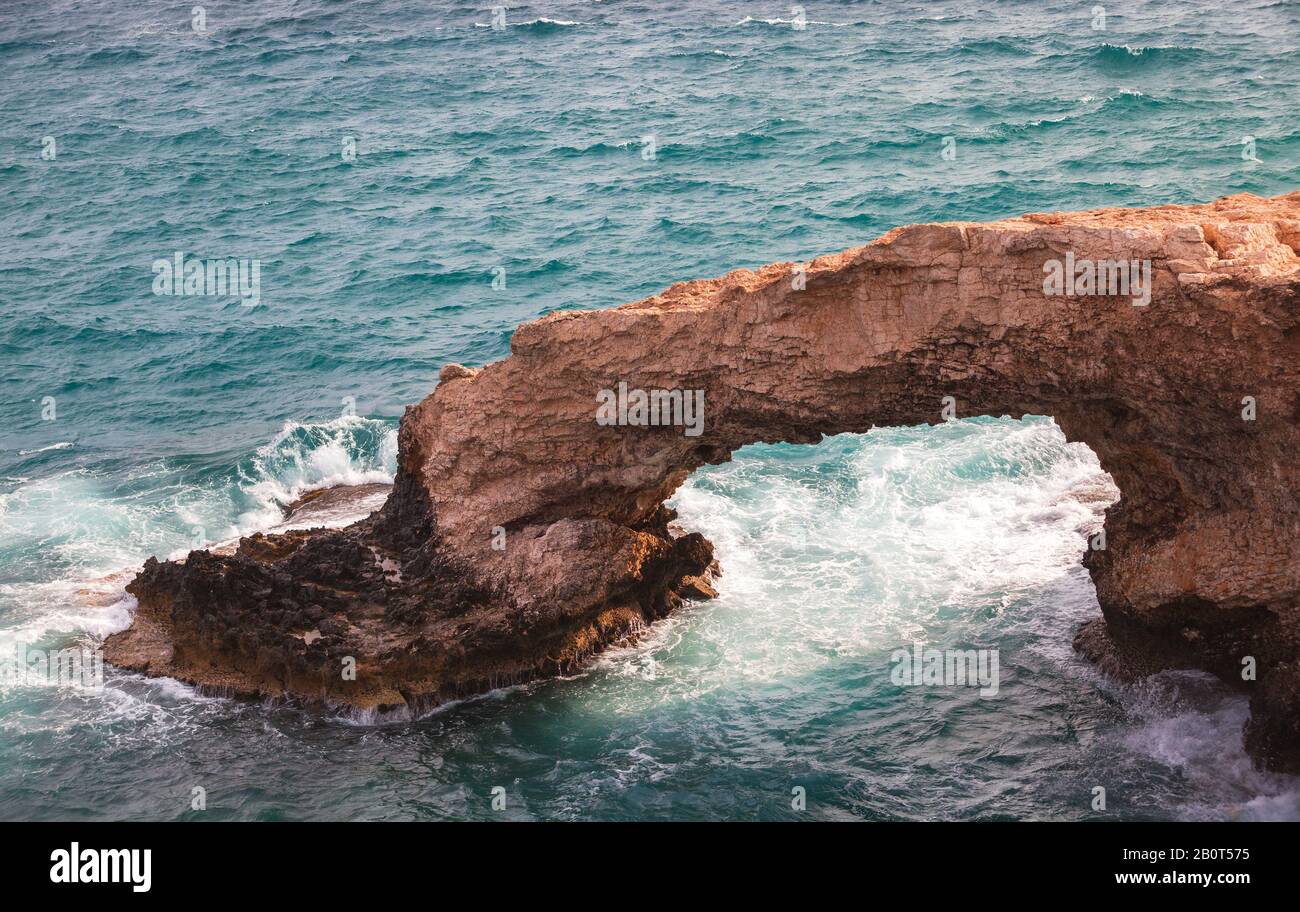 Stone arch known as the Love bridge. Natural landmark placed near Ayia ...