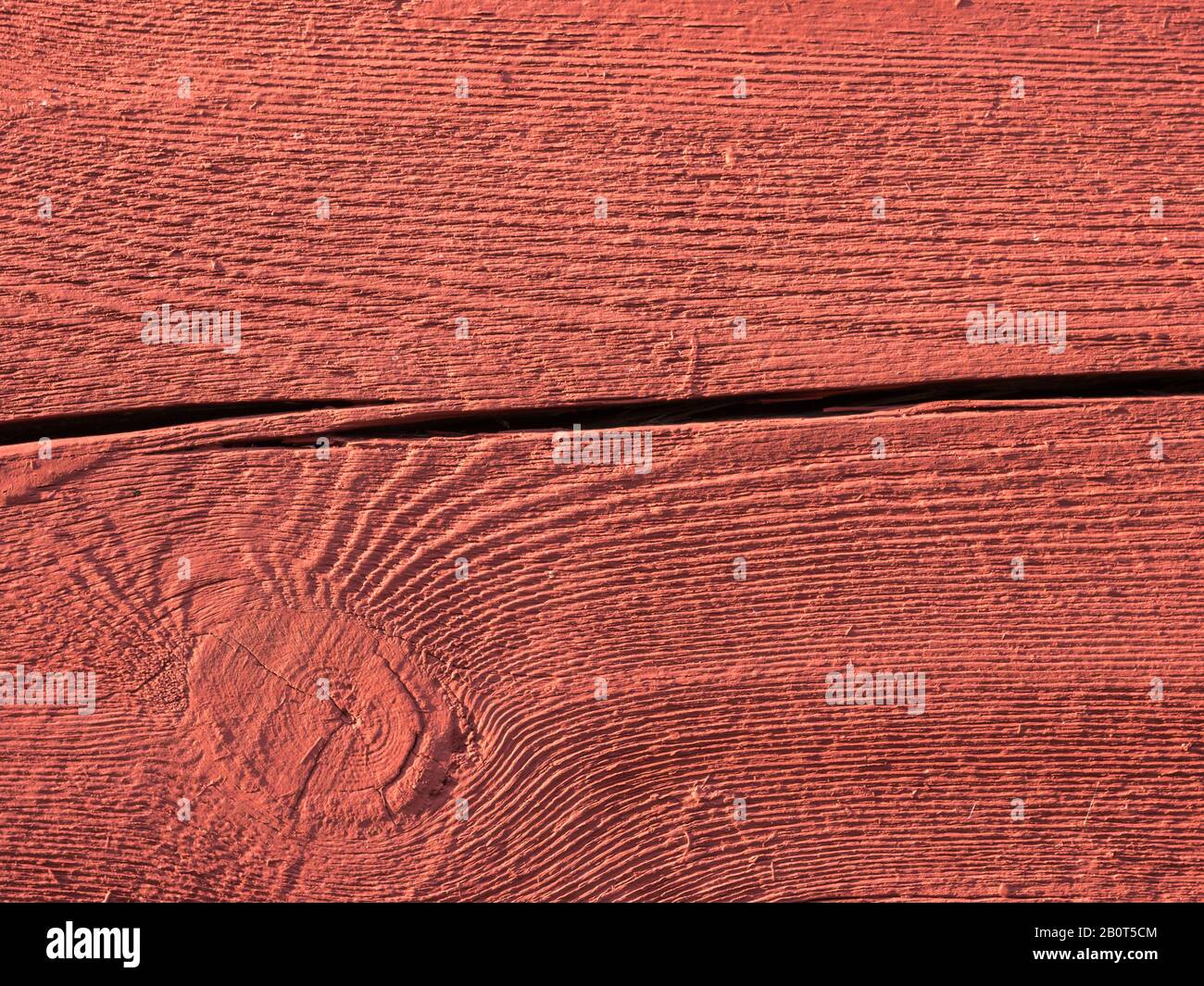 Log wall surface painted red Stock Photo - Alamy