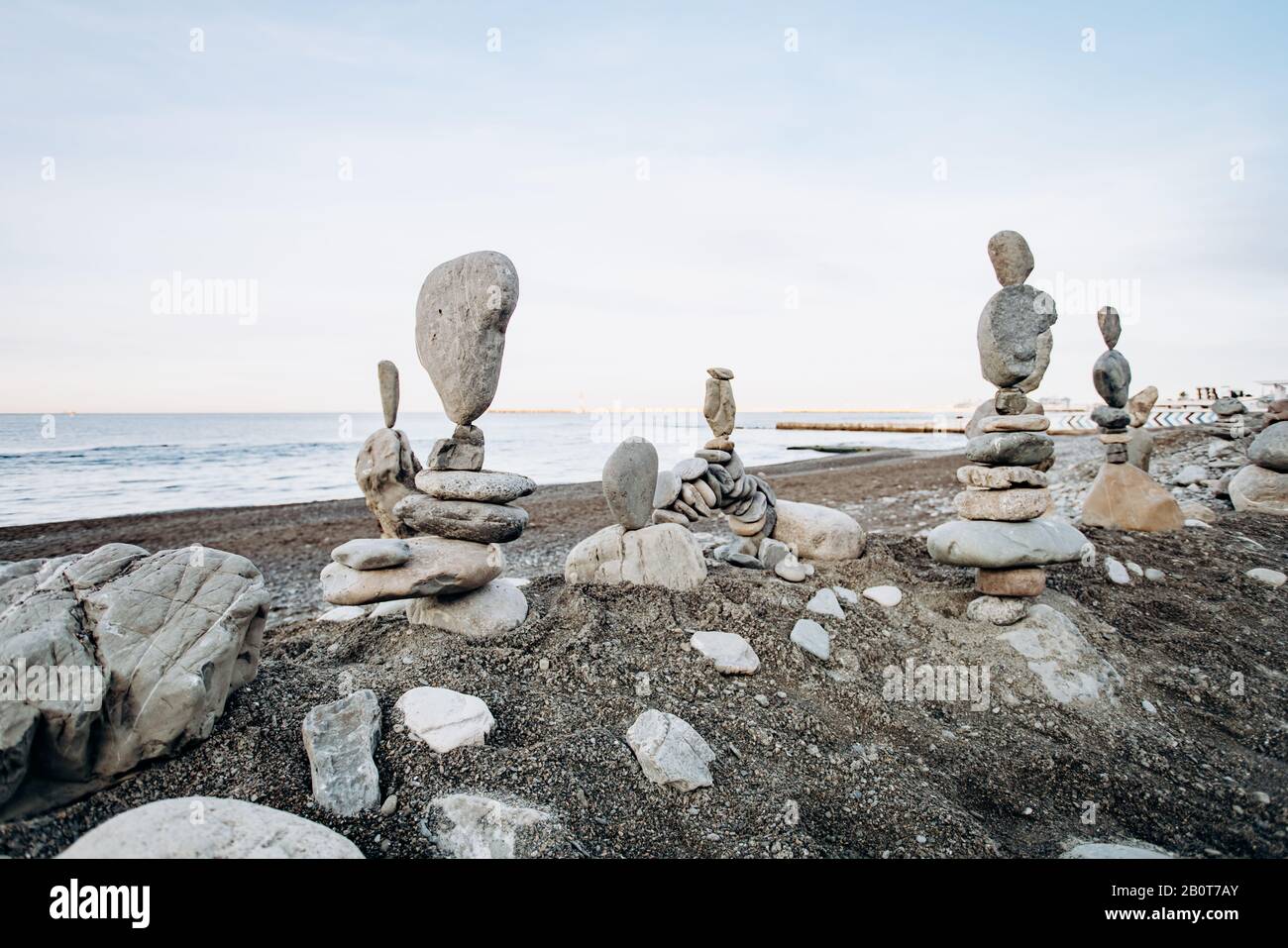 Figures of stones on the beach near the sea. Sea background and stone ...