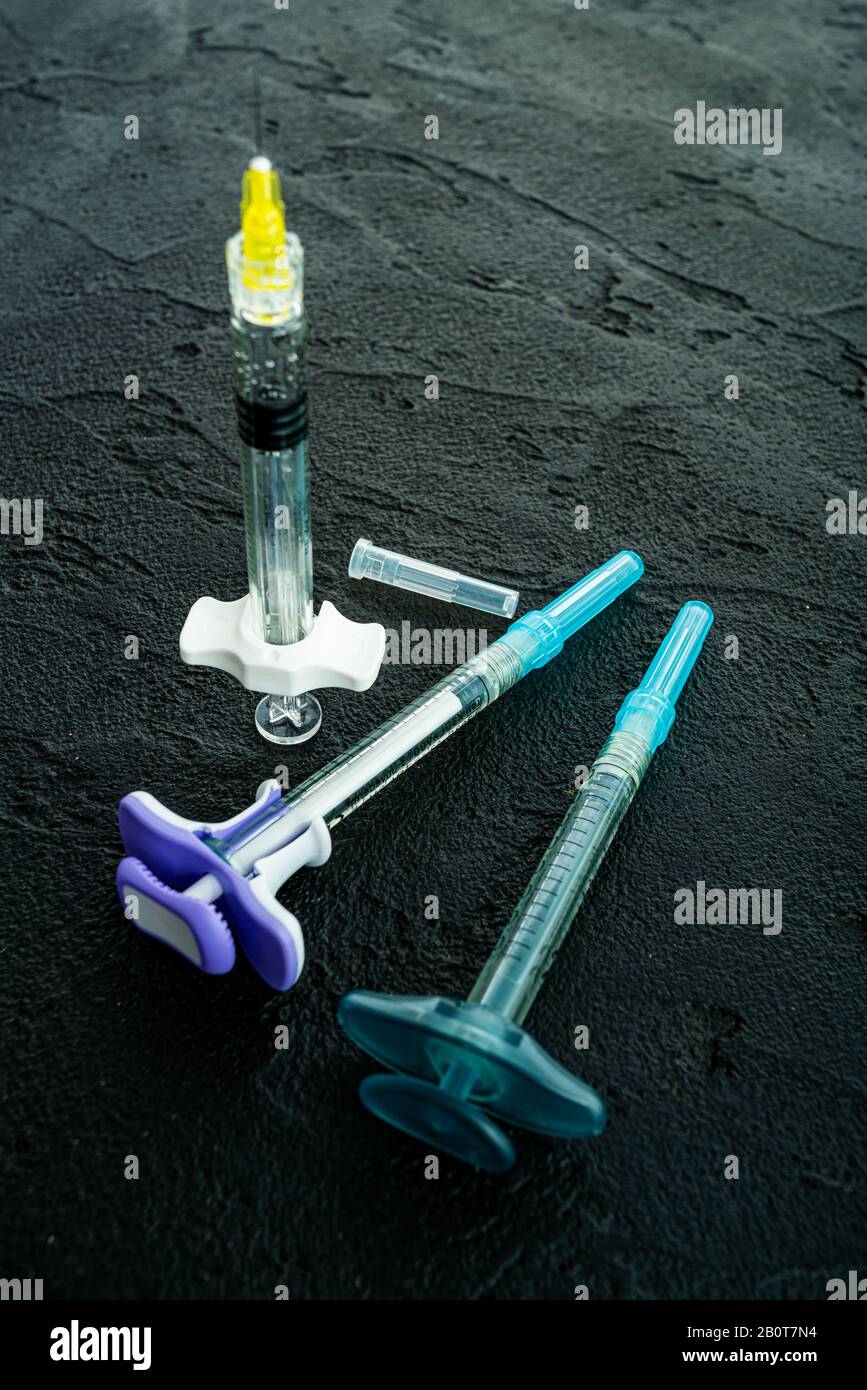 A set of different syringes on lack. Face Cosmetics Injecting Stock ...