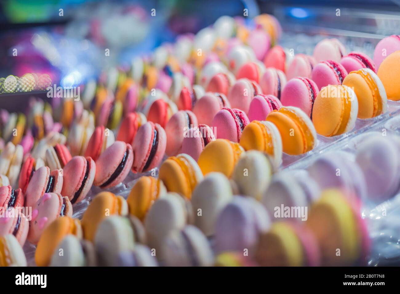 Colorful macarons for sale on counter of candy shop Stock Photo - Alamy
