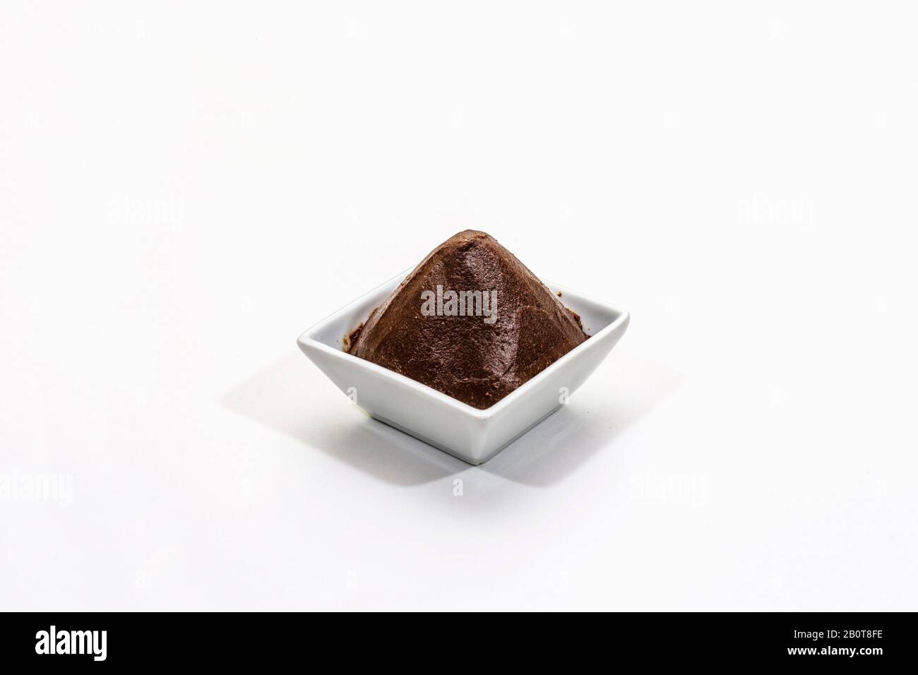 Dark brown miso paste isolated on white background. Traditional ...