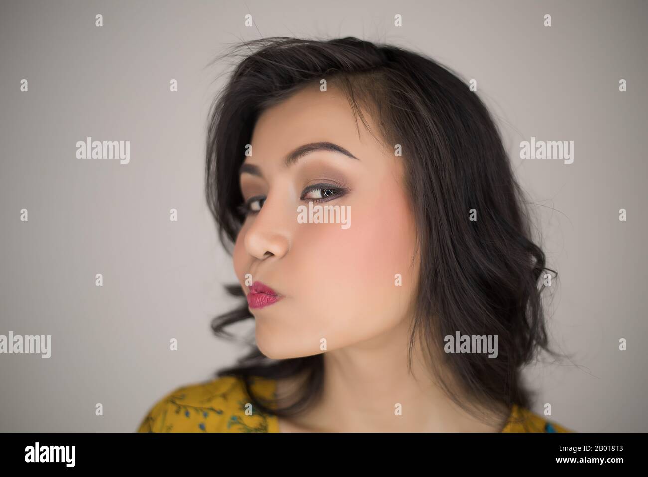 beautiful woman show cheek on white background Stock Photo - Alamy