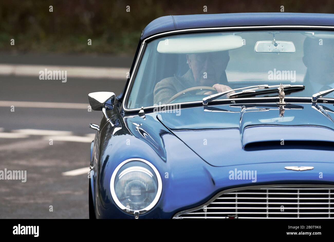 The Prince of Wales driving his Aston Martin DB6 arrives for a visit to ...