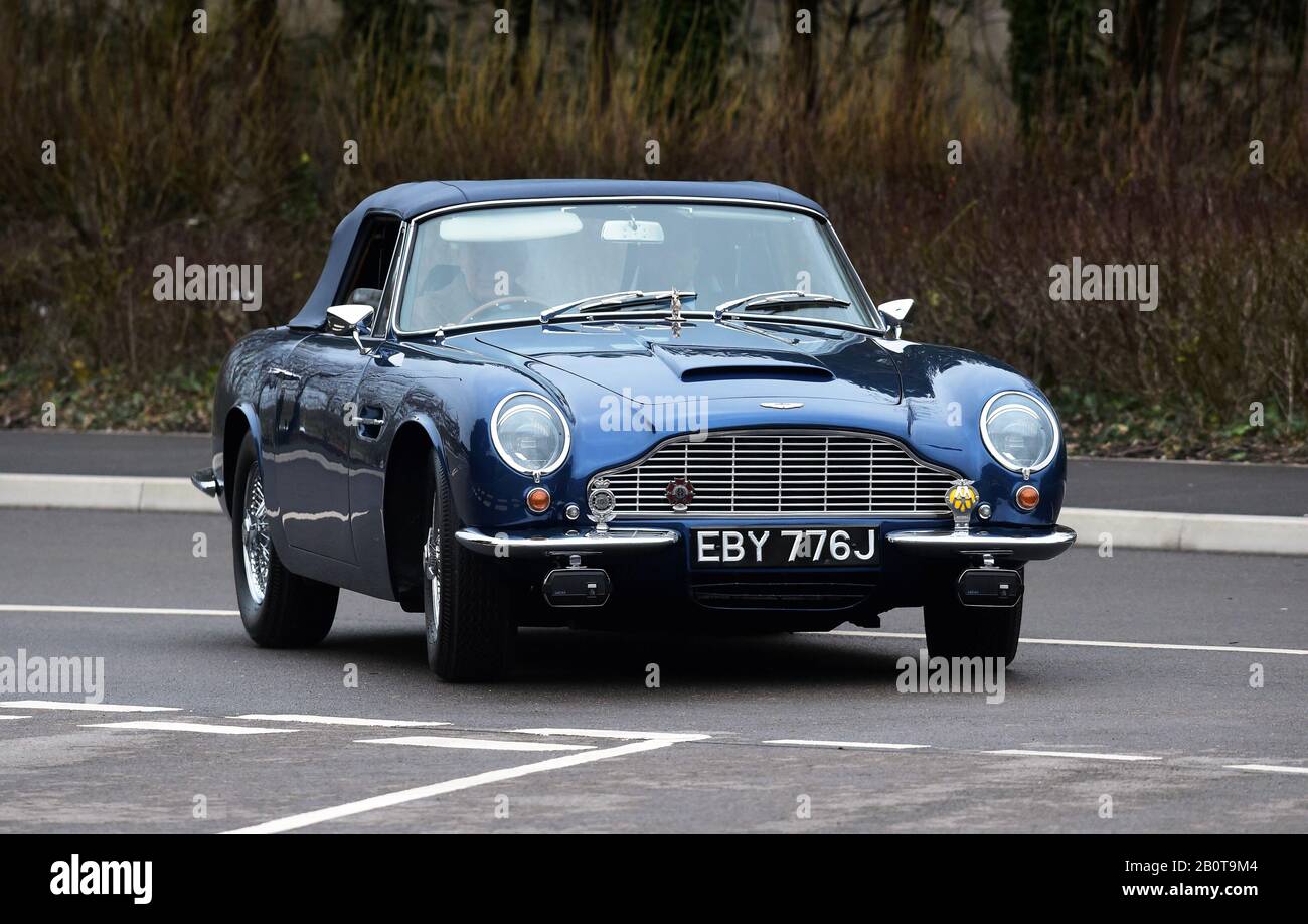 The Prince of Wales driving his Aston Martin DB6 arrives for a visit to ...
