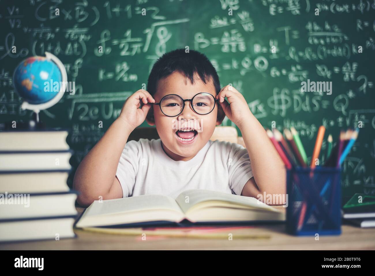 Portrait of a boy in the classroom Stock Photo - Alamy