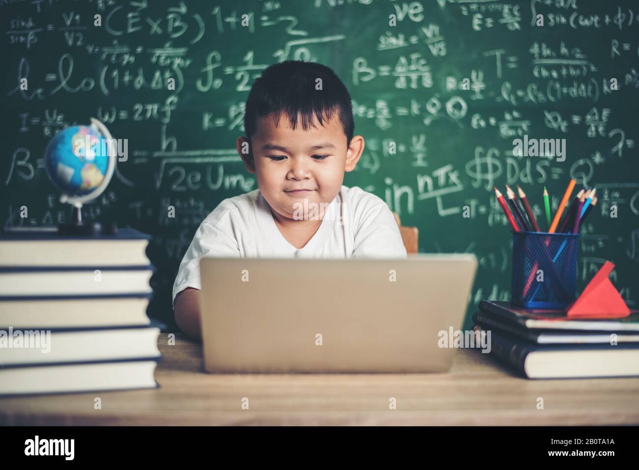 kid use computer laptop in the classroom Stock Photo - Alamy