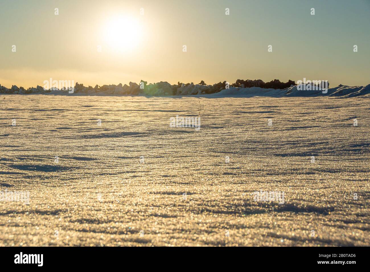 arctic lifeless landscape with a strip of hummocks on the horizon ...