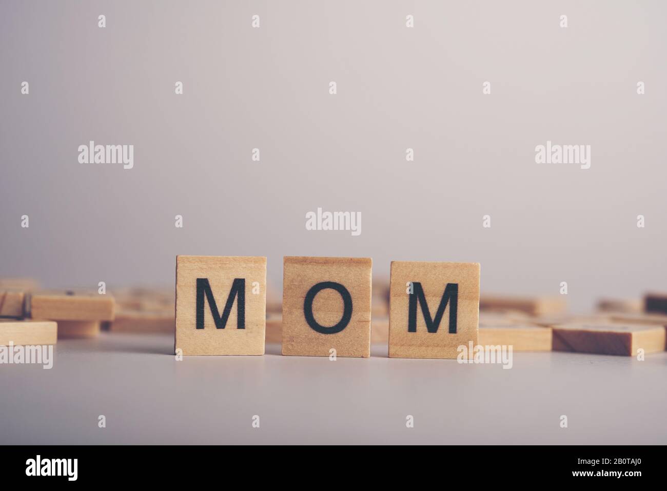 MOM wooden tile font concept Stock Photo - Alamy