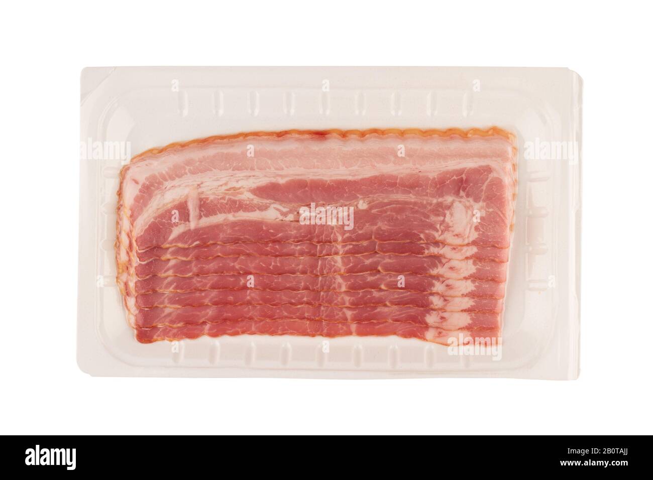 top view of slices of smoked pork loin ham in transparent plastic ...