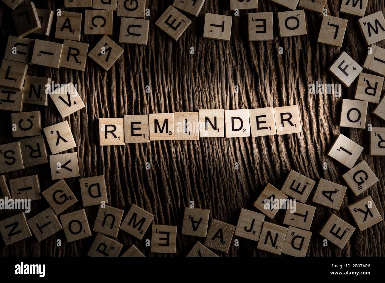 REMINDER wooden tile font concept Stock Photo - Alamy
