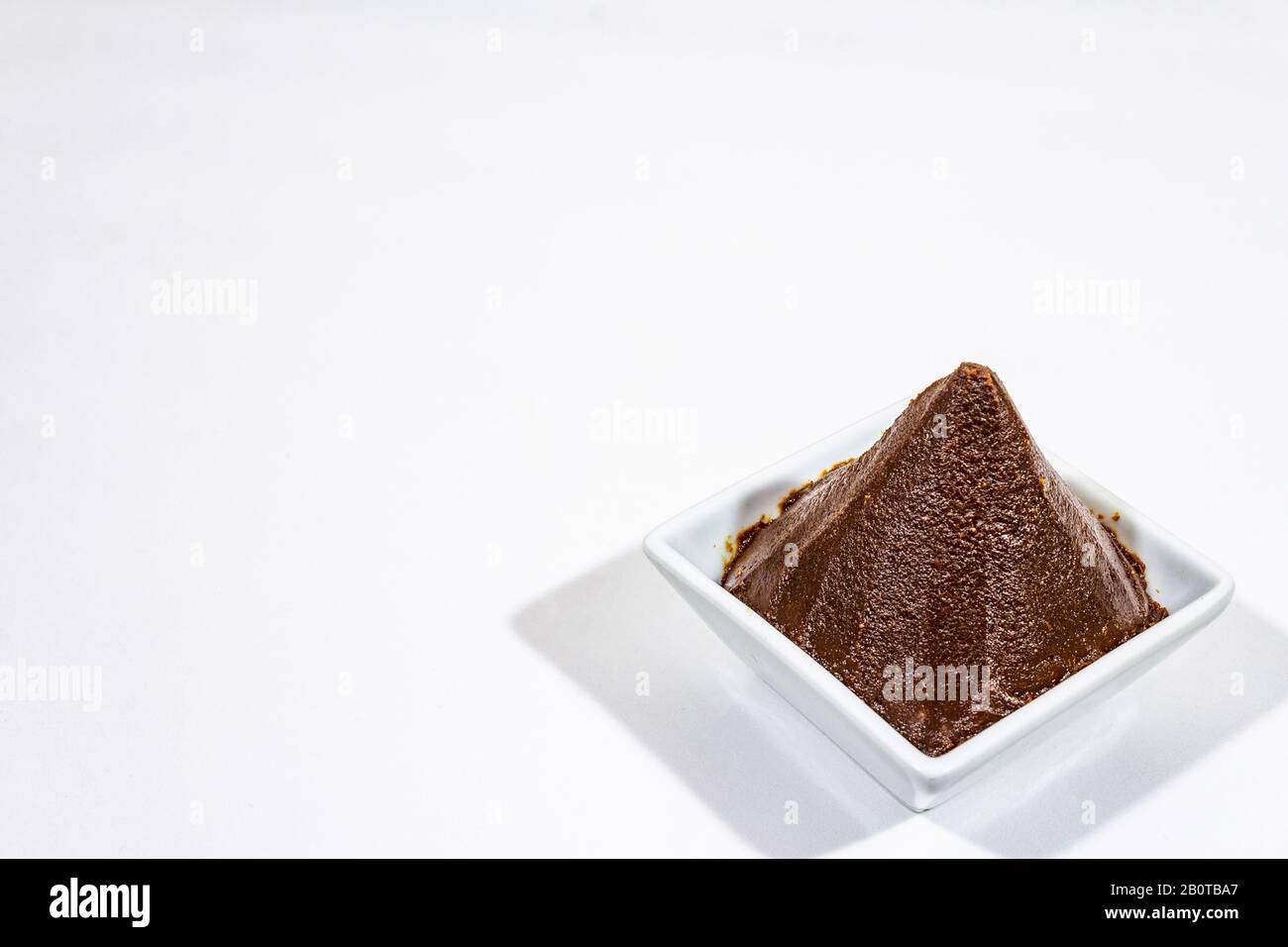 Dark brown miso paste isolated on white background. Traditional ...