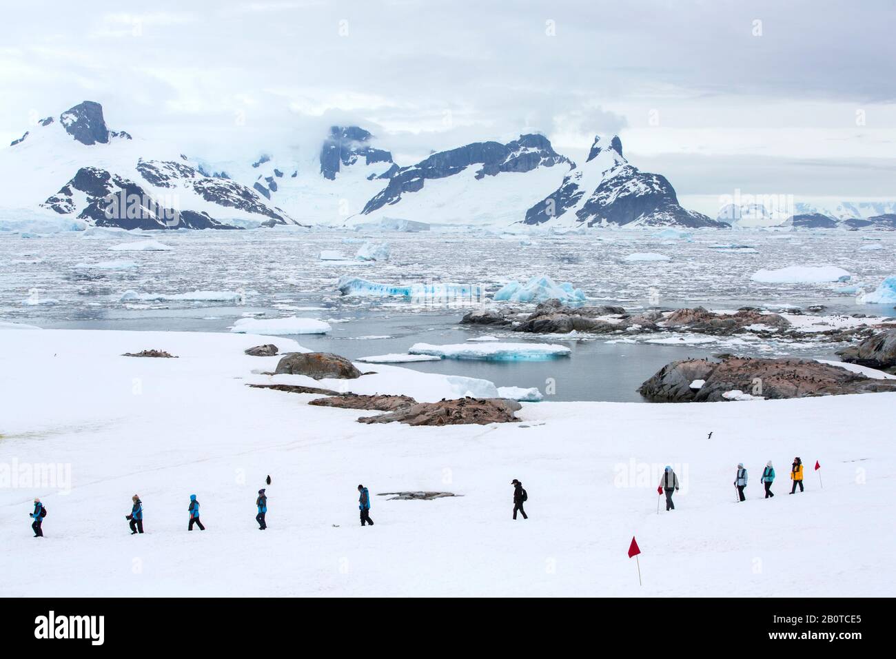 Tourists from an expedition cruise ship on Peterman Island near the ...