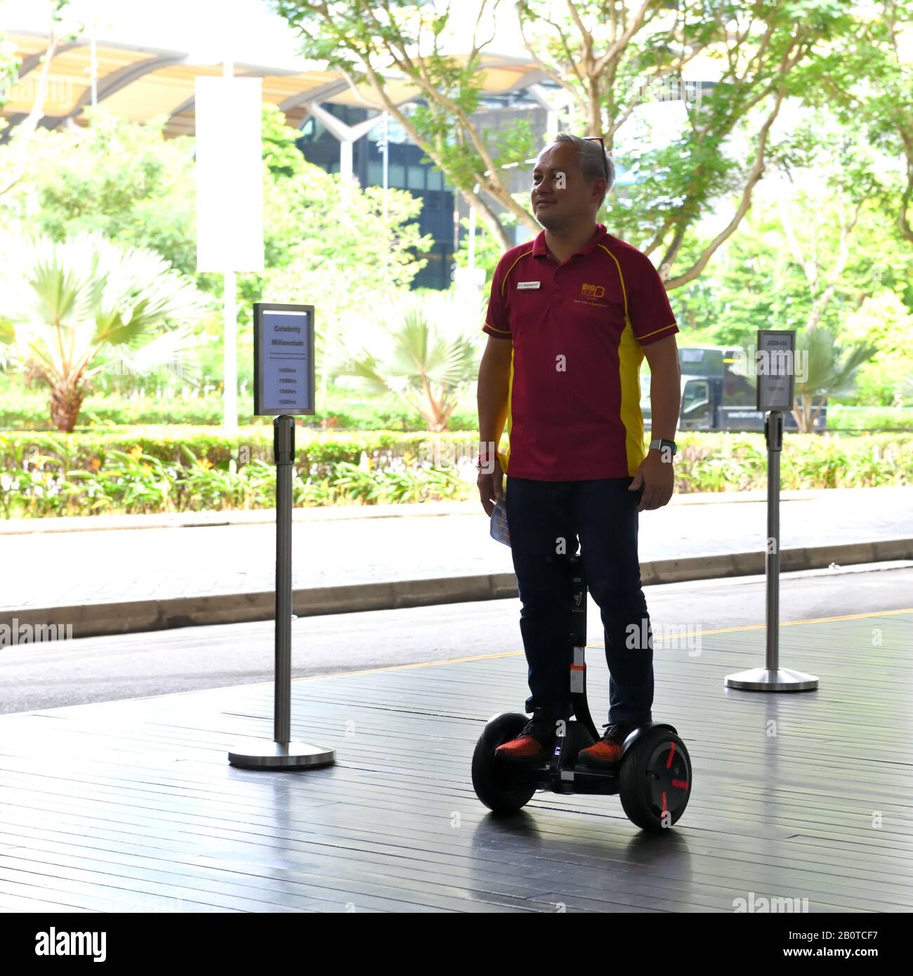 A bus terminus manager using a mini Segway to patrol the terminus ...