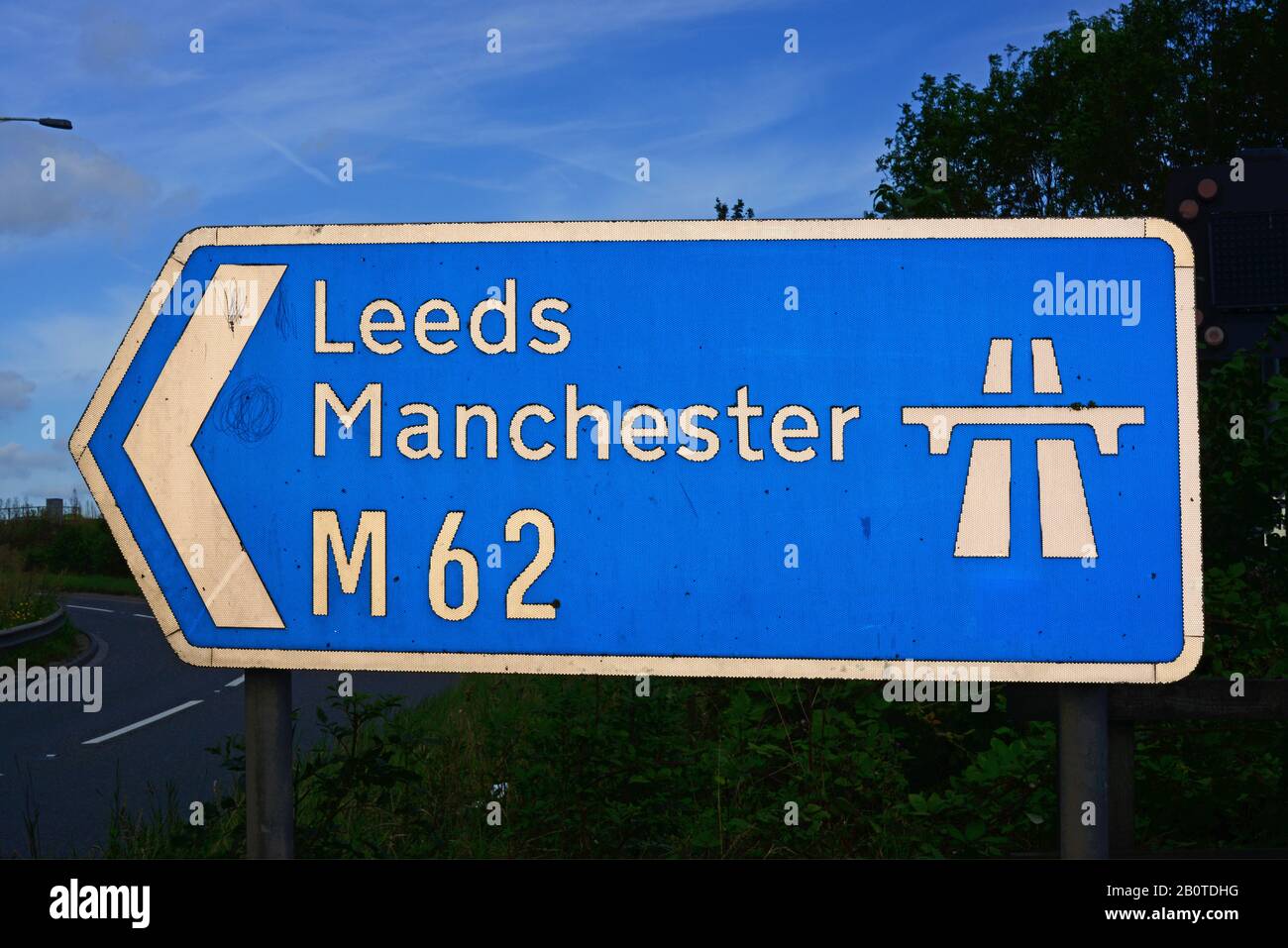 traffic passing m62 motorway sign to leeds and manchester at normanton ...