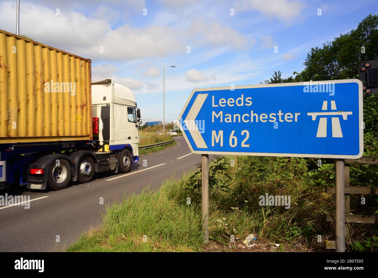 traffic passing m62 motorway sign to leeds and manchester at normanton ...