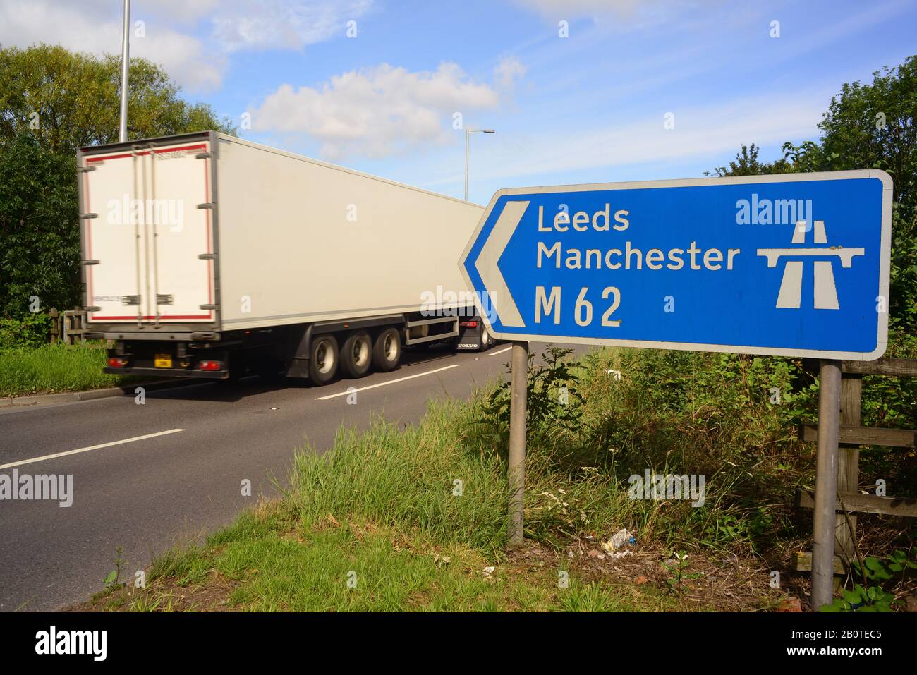 traffic passing m62 motorway sign to leeds and manchester at normanton ...